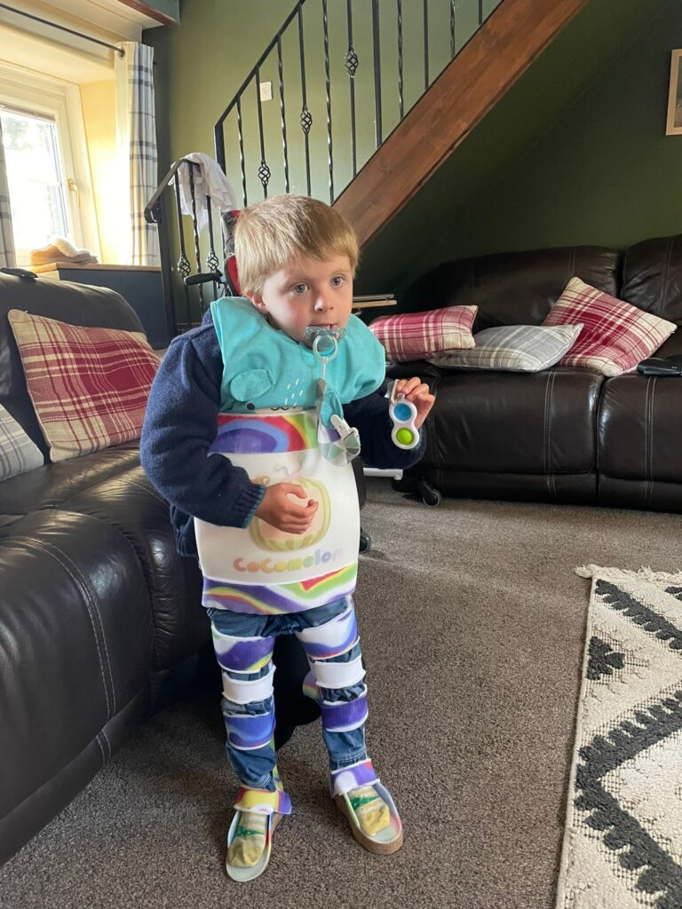 Seth, age 4, stands for the first time thanks to an orthotic standing ...